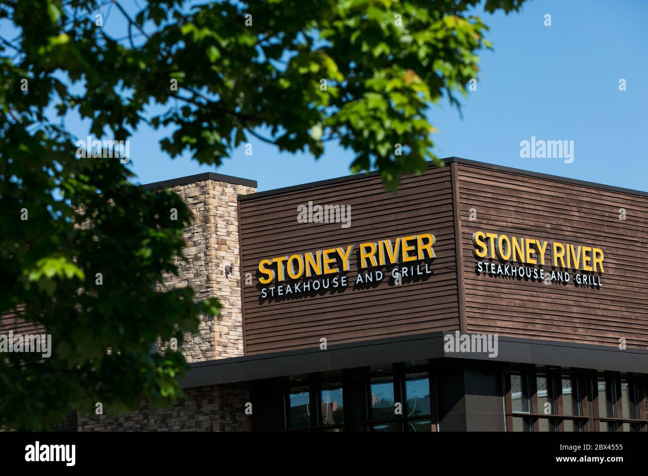 A logo sign outside of a Stoney River Steakhouse and Grill restaurant ...