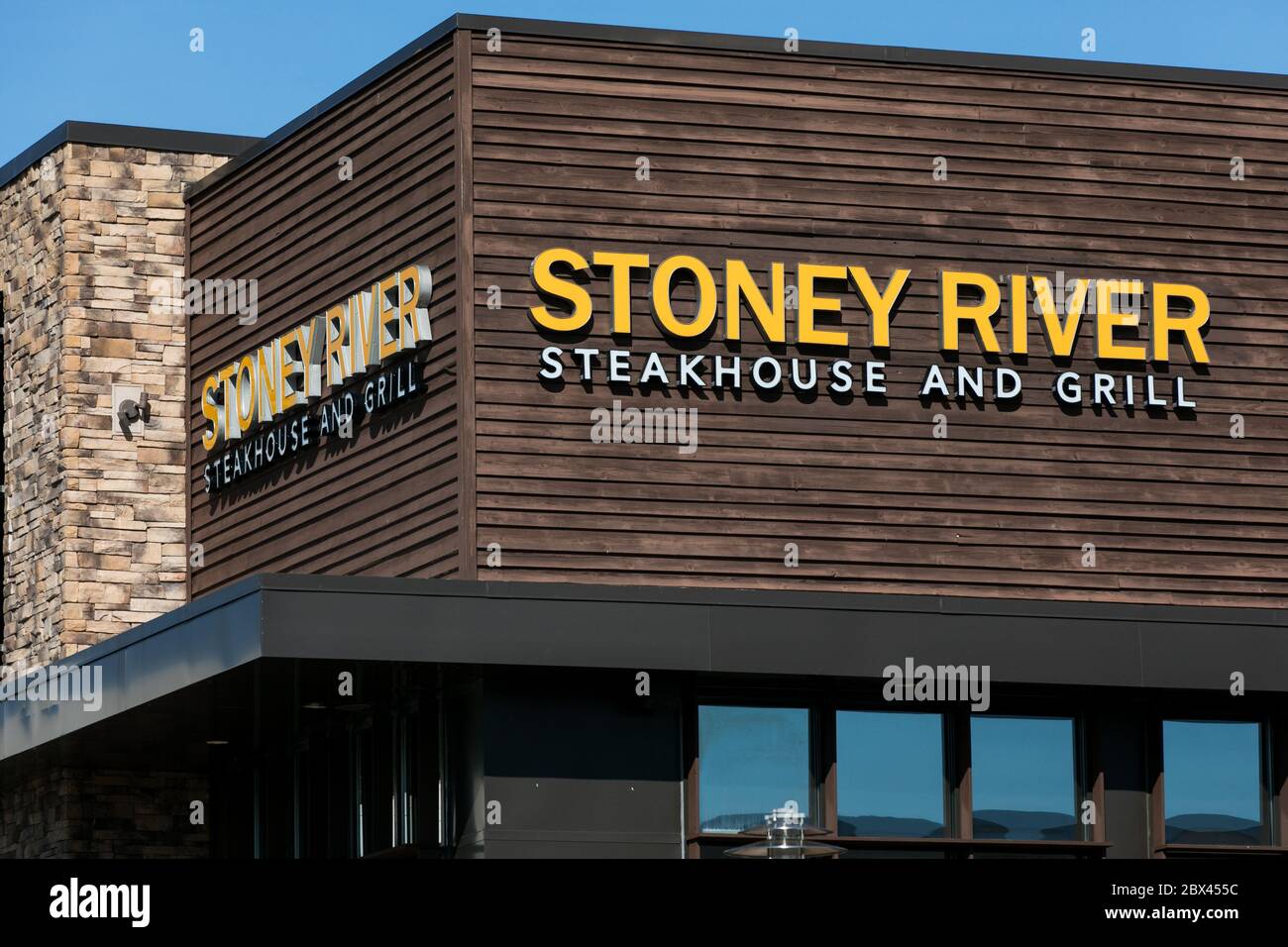 A logo sign outside of a Stoney River Steakhouse and Grill restaurant ...