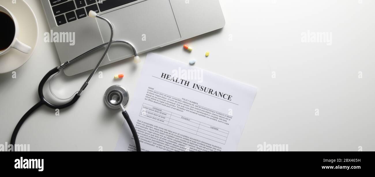 Life planning concept with health insurance form, stethoscope, laptop ...
