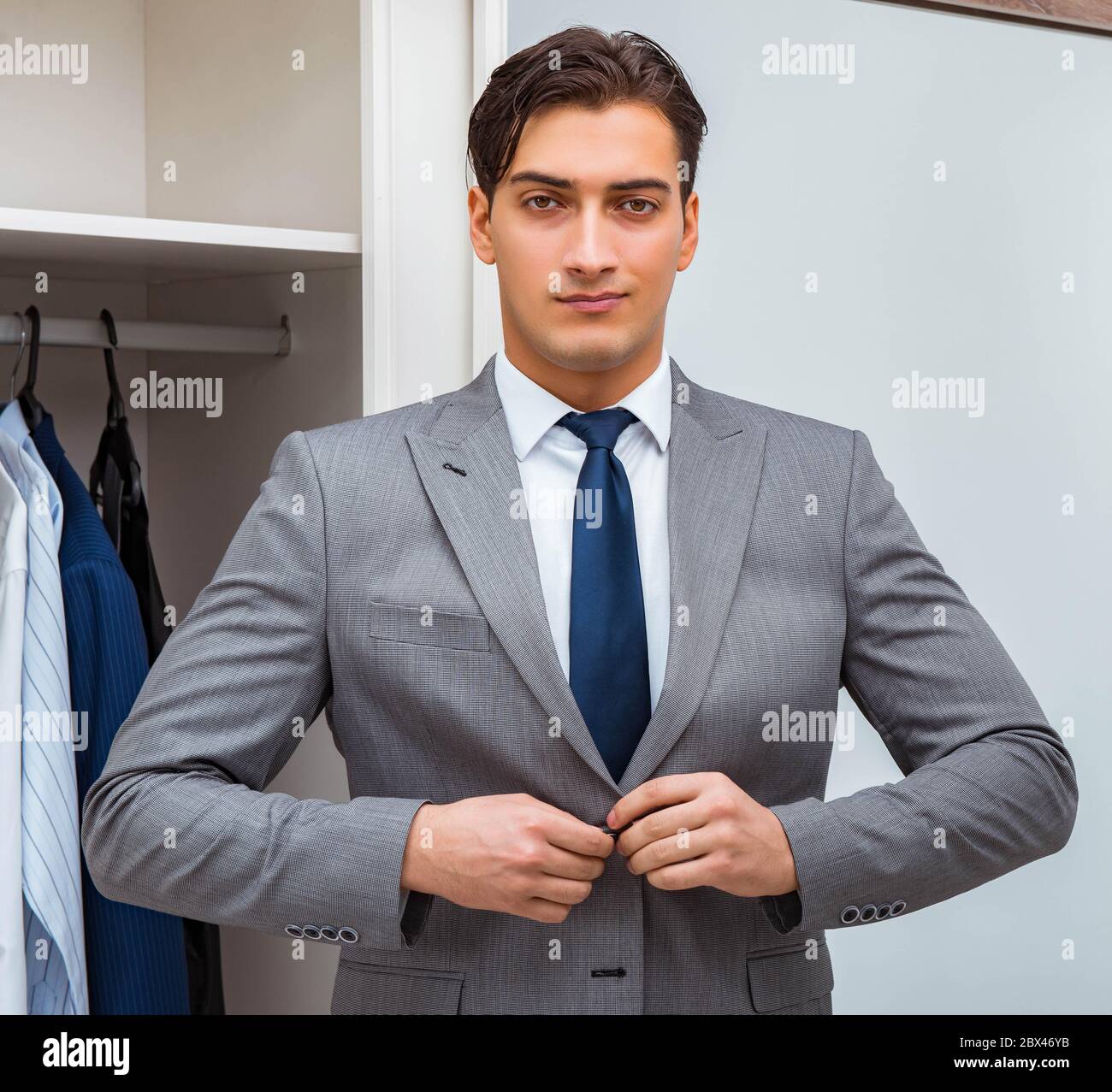 The businessman dressing up for work Stock Photo - Alamy