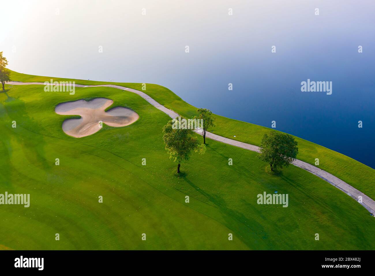 Aerial view of golf field landscape with sunrise view in the morning ...