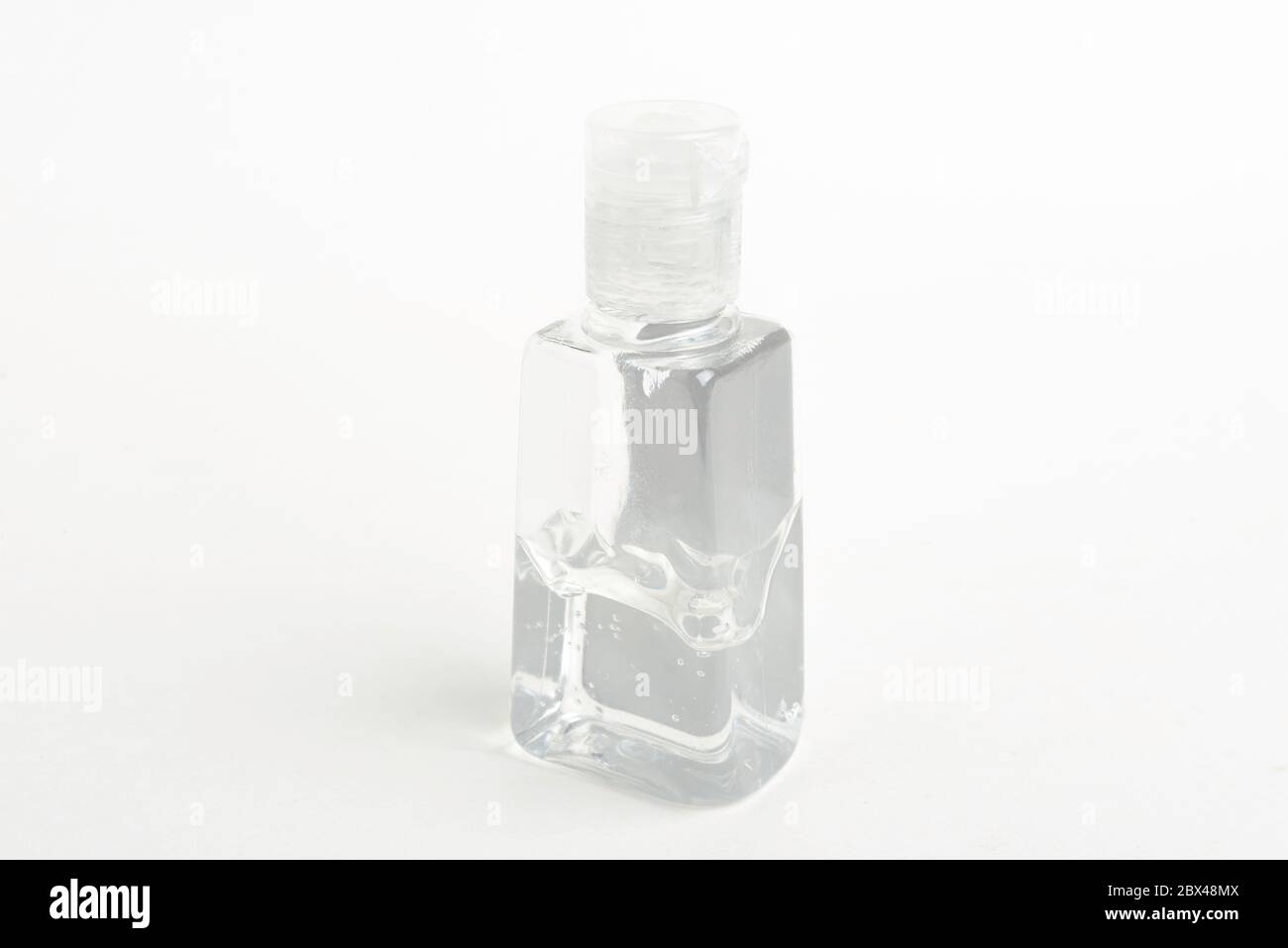 A product shot of a generic pocket-size transparent hand sanitizer ...