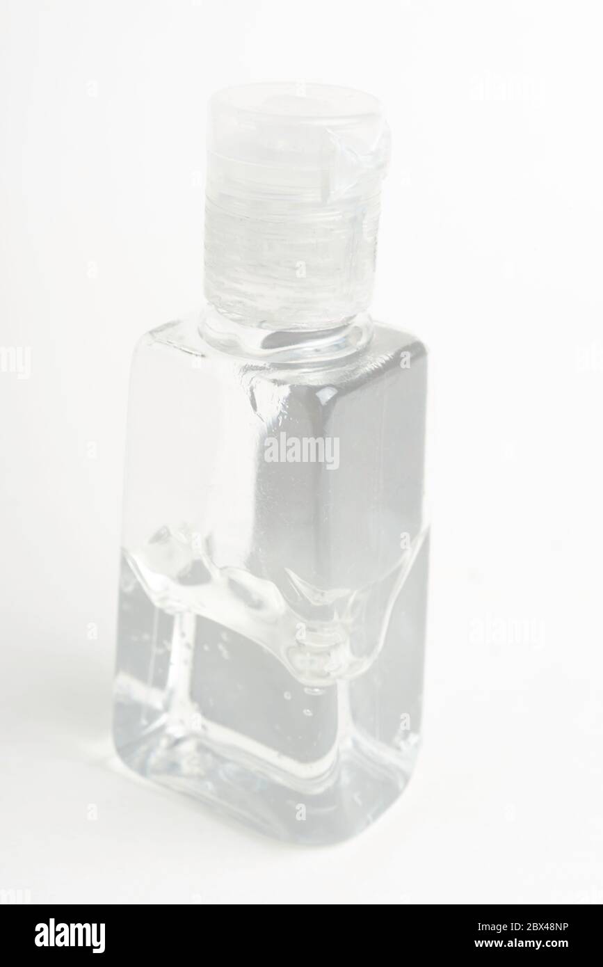 A product shot of a generic pocket-size transparent hand sanitizer ...