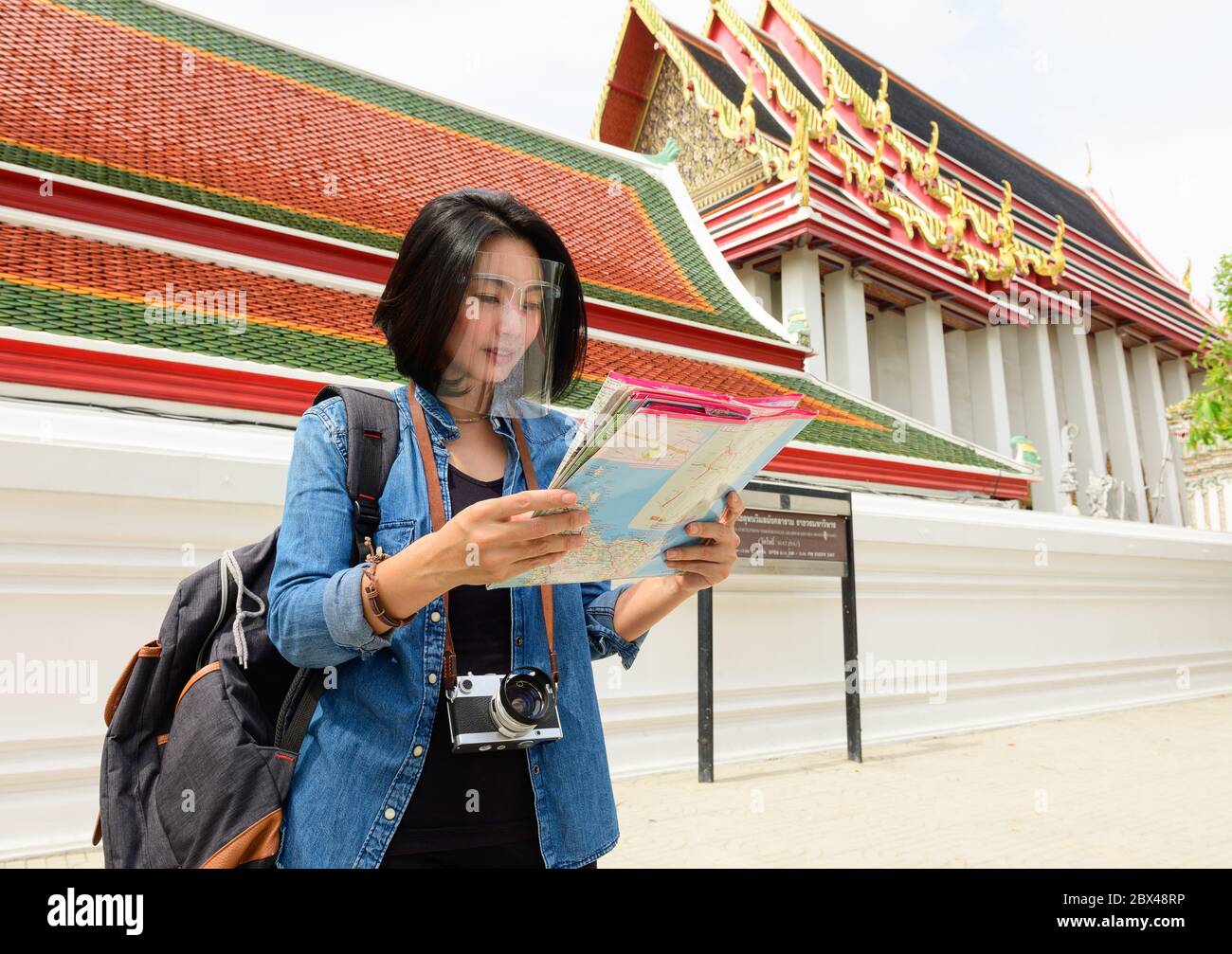 Asian tourist wearing protective face shield during coronavirus ...