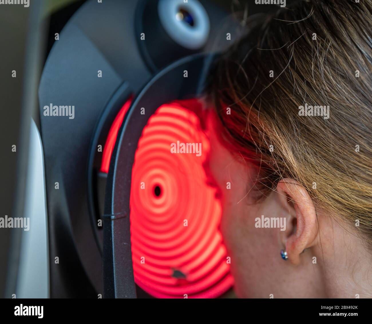 visual examination of the eyes of a young woman at the eye clinic Stock ...