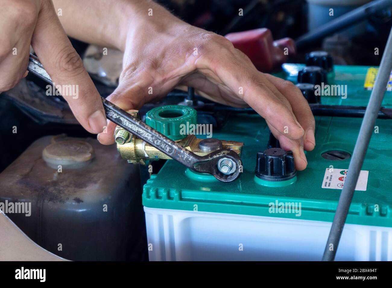 Repairing the battery by a technician from the service center. Service ...