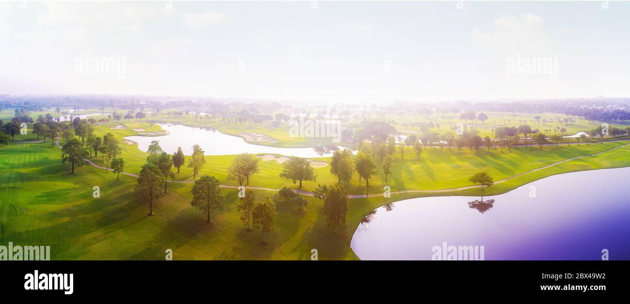 Aerial view of golf field landscape with sunrise view in the morning ...