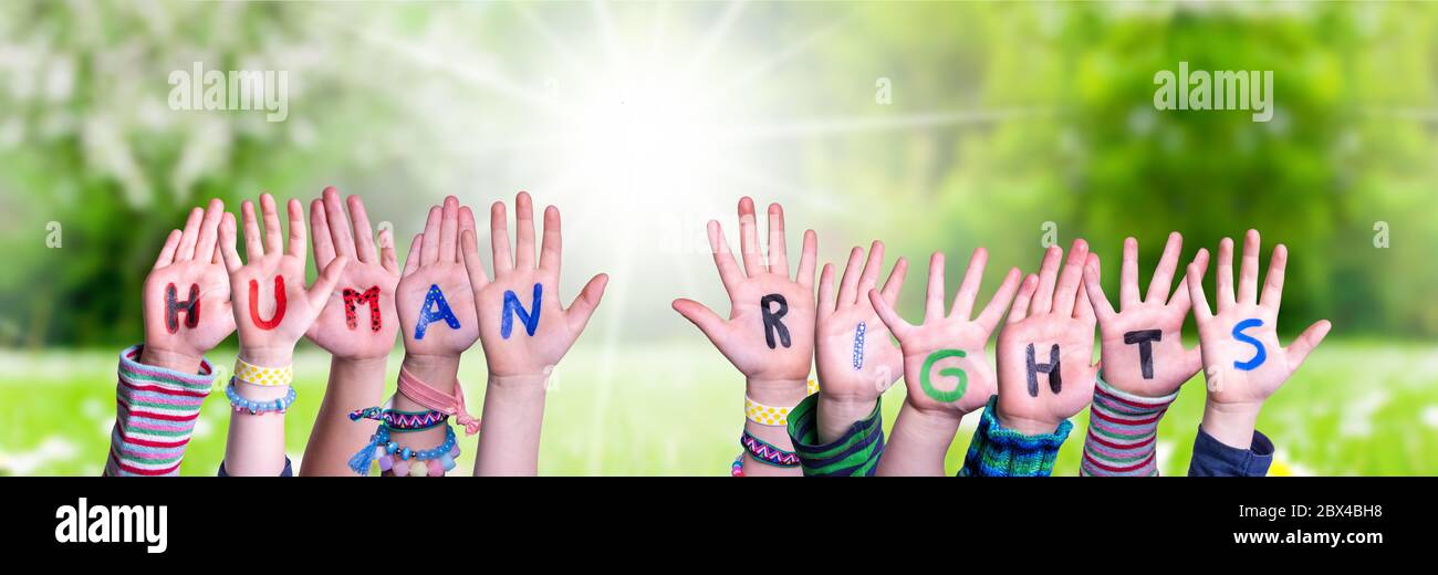 Children Hands Building Word Human Rights, Grass Meadow Stock Photo - Alamy