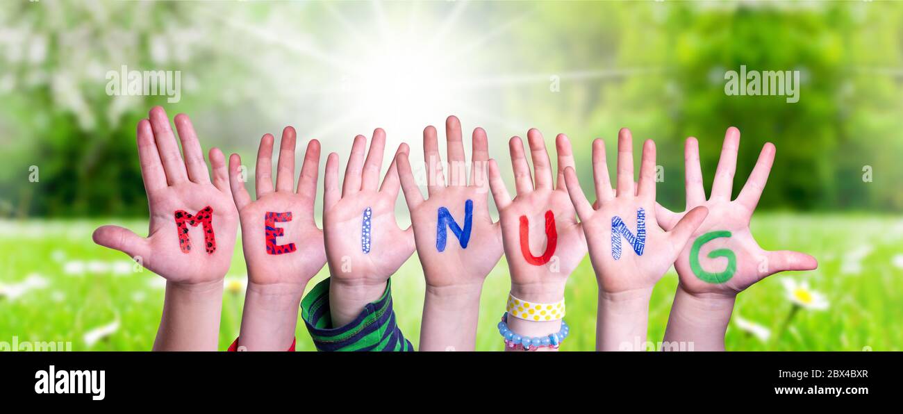 Children Hands Building Word Meinung Means Opinion, Grass Meadow Stock ...