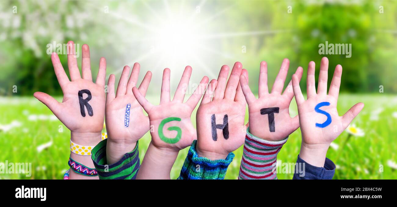 Children Hands Building Word Rights, Grass Meadow Stock Photo - Alamy