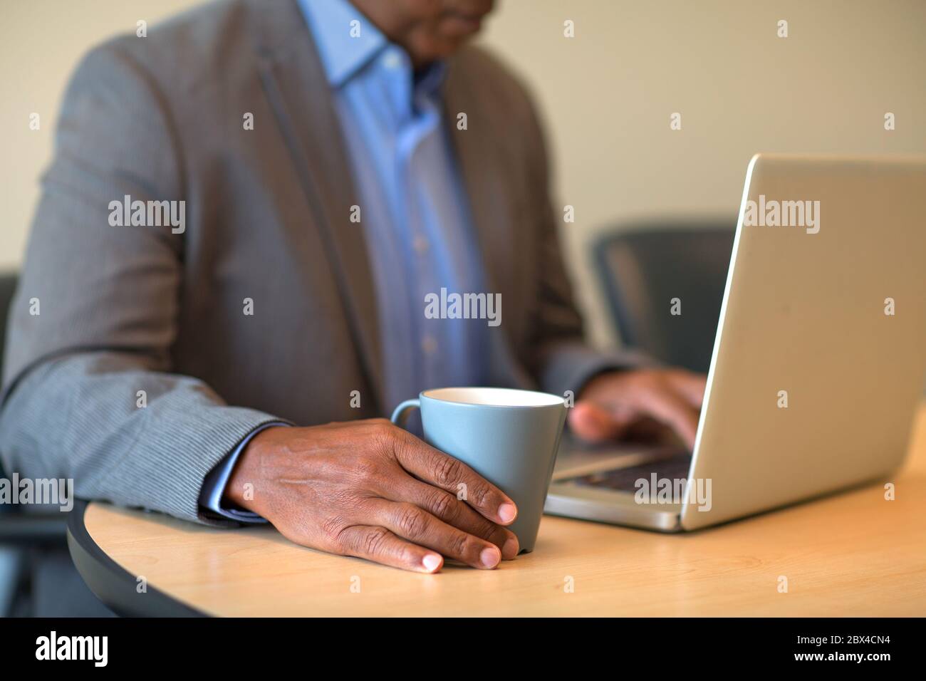 African American man at typing on a computer Stock Photo - Alamy