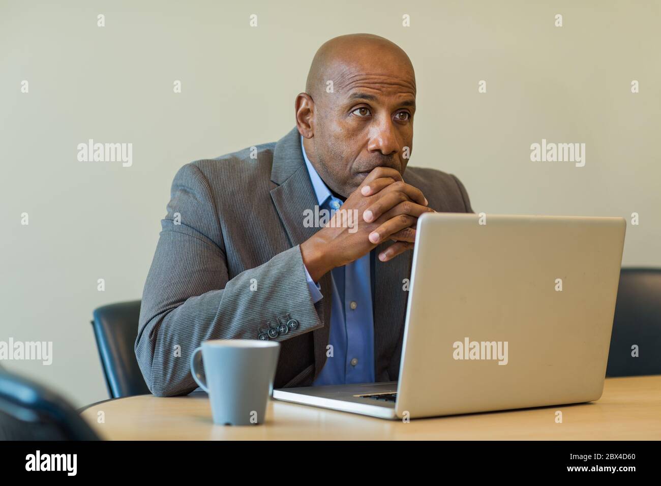African American man having a difficult time at work Stock Photo - Alamy