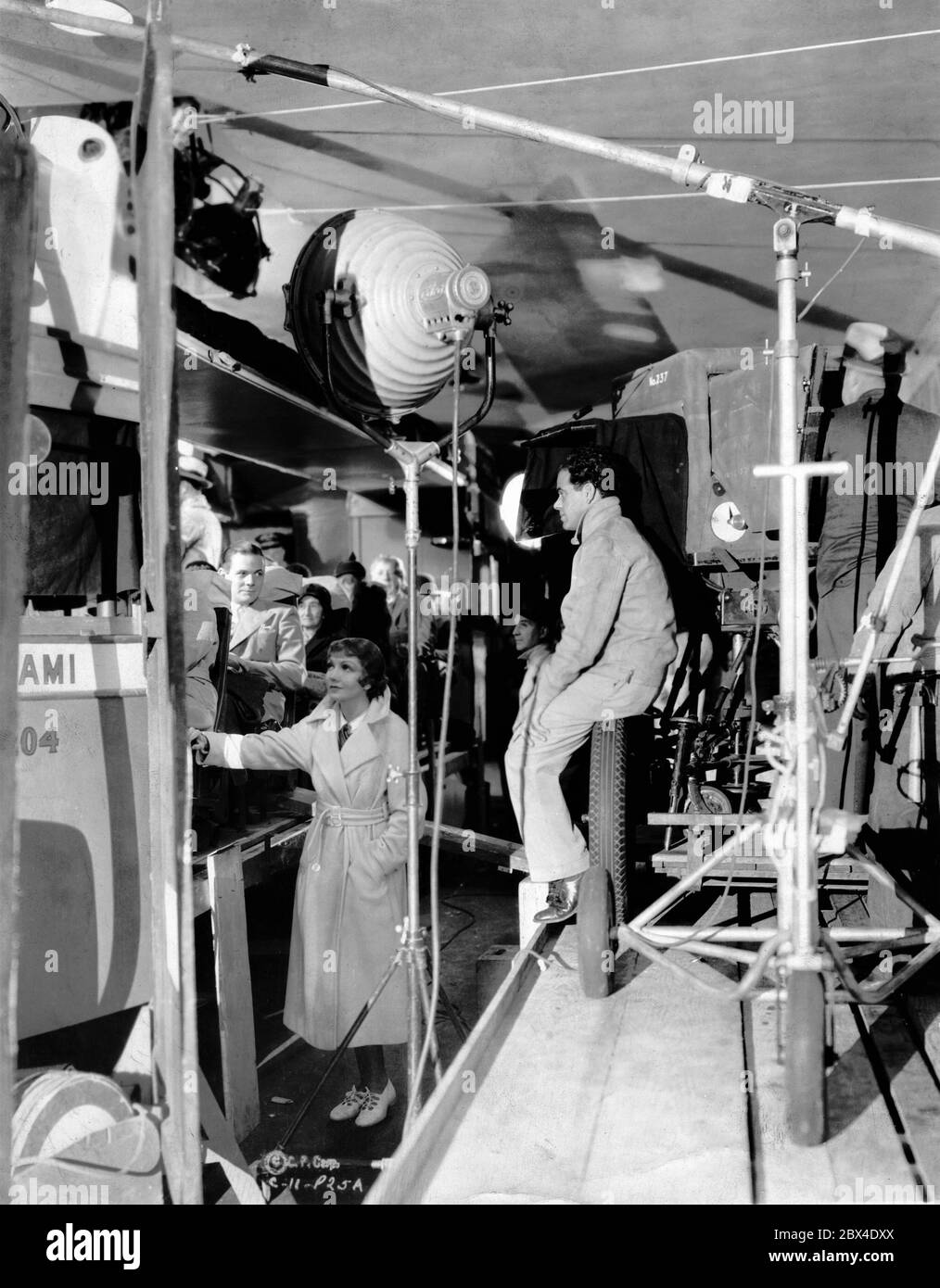 Director FRANK CAPRA with Film Crew and CLAUDETTE COLBERT on set candid ...