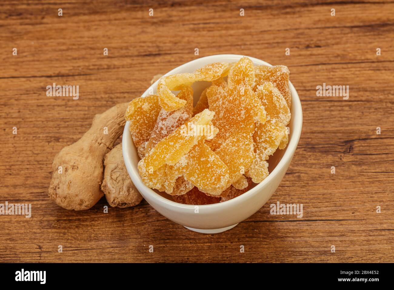 Dry sweet ginger snack in the bowl Stock Photo - Alamy