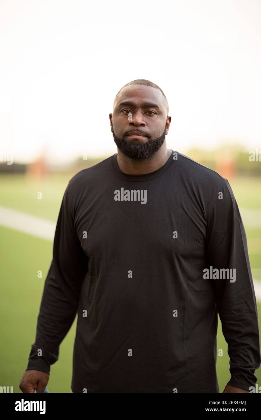Portrait of an African American Football coach smiling Stock Photo - Alamy