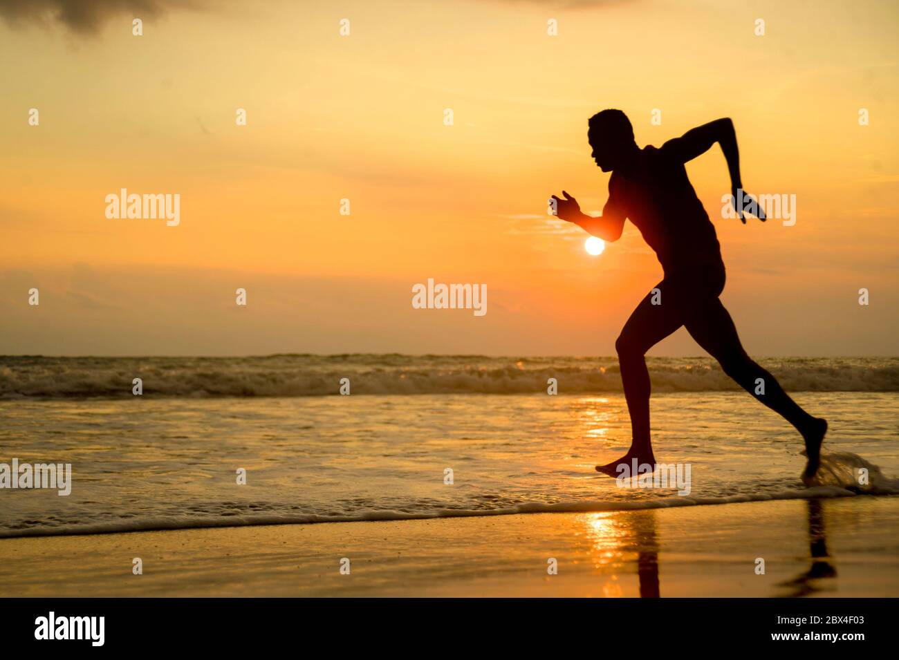 silhouette of young attractive fit athletic and strong black African ... silhouette of young attractive fit athletic and strong black African ...