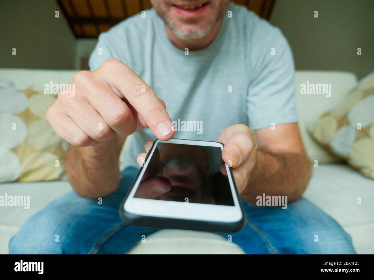 face crop lifestyle portrait with close up hands of young happy man ...