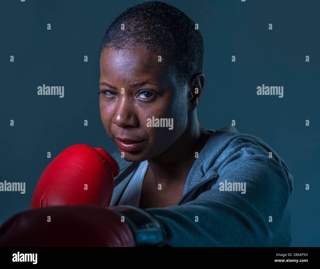 close up face portrait of young angry and defiant black afro American ...
