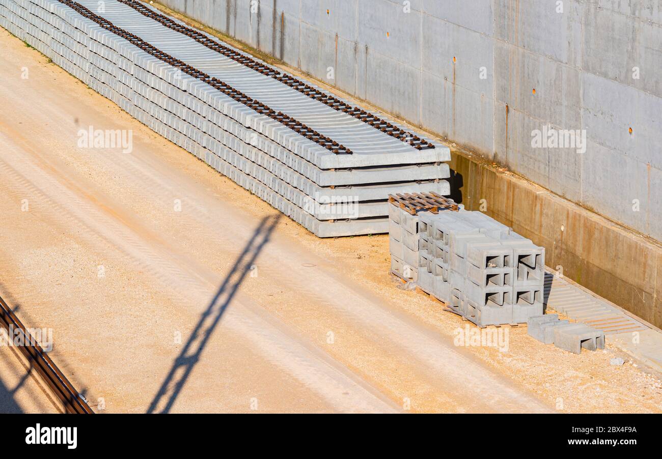 Pile of precast concrete sleepers ready for construction in trackwork ...