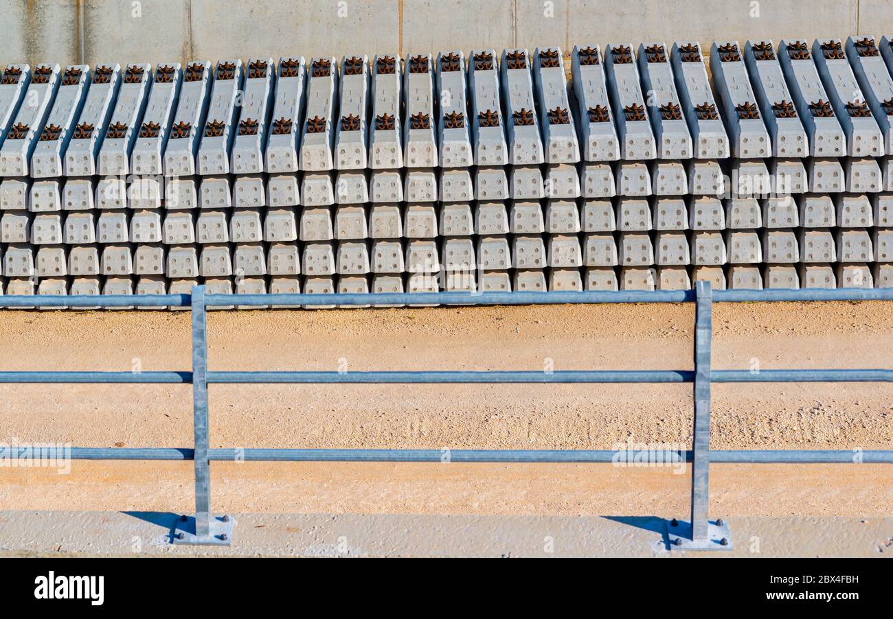 Pile of precast concrete sleepers ready for construction in trackwork ...