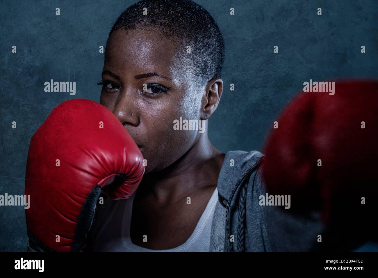 close up face portrait of young angry and defiant black afro American ...
