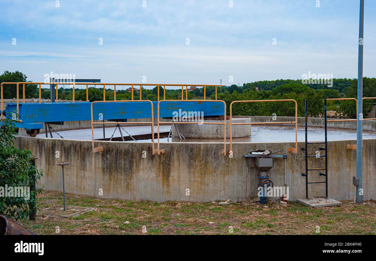 Sewage treatment plant. Primary sedimentation basin, sewage flowing ...