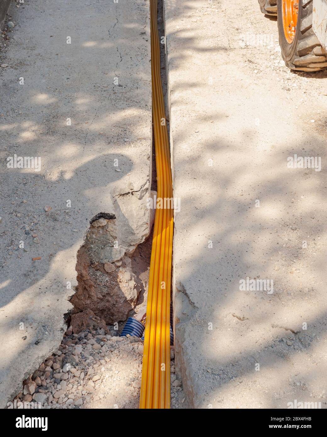 fiber optic cables buried in a micro trench Stock Photo - Alamy