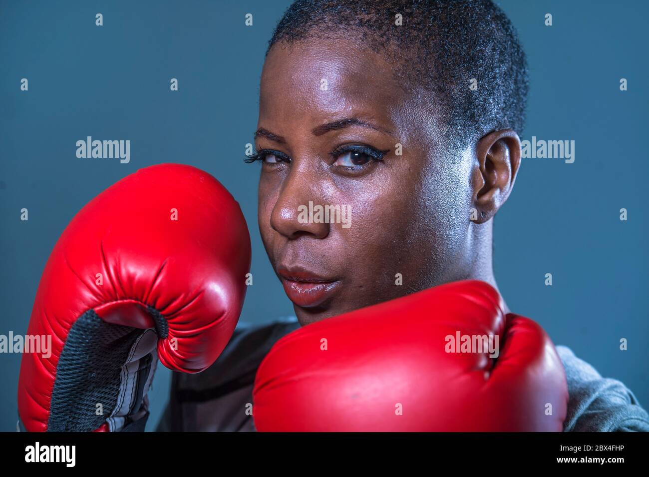 close up face portrait of young angry and defiant black afro American ...
