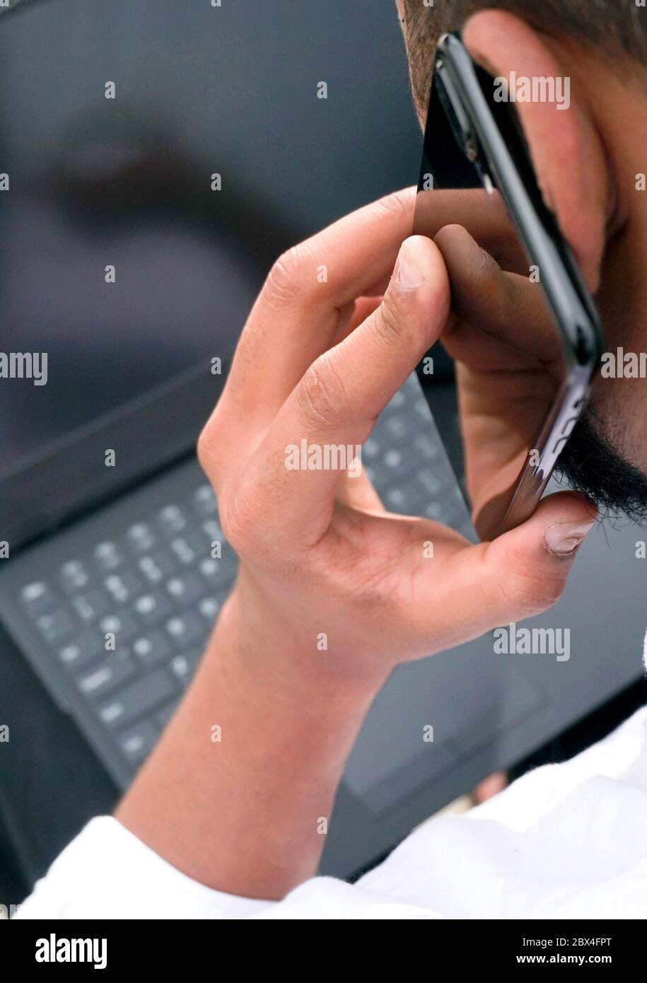 Indian work from home phone laptop hi-res stock photography and images ...