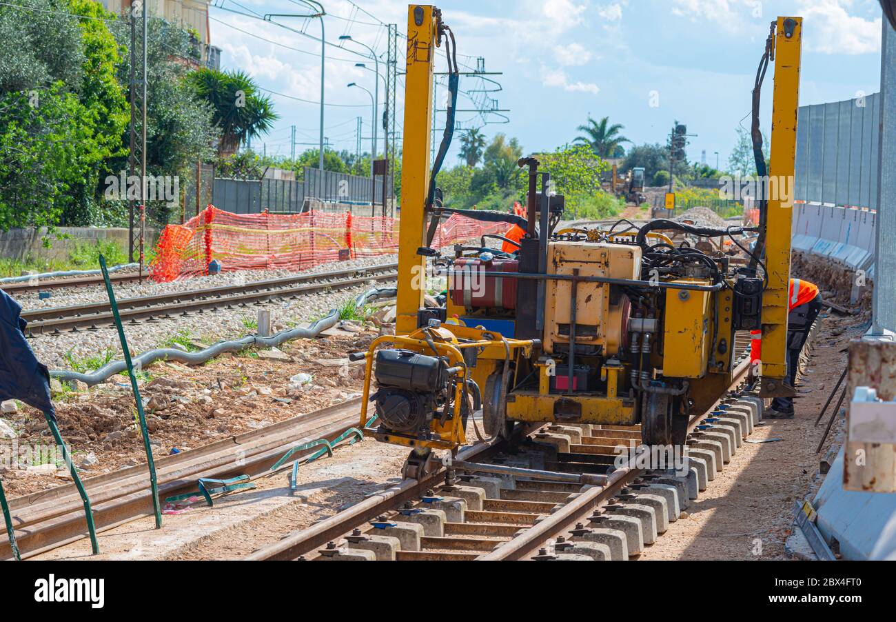 Rail excavator on reconstruction of the railway rails Stock Photo - Alamy