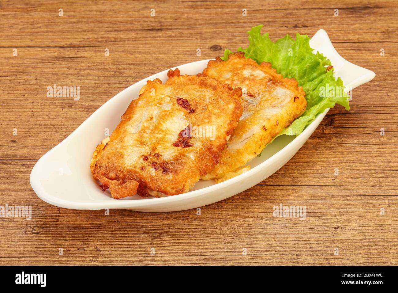 Roasted cod fish in the bread Stock Photo - Alamy