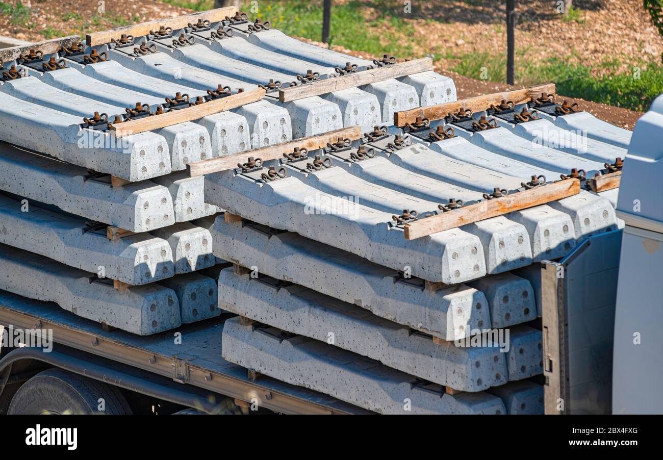 Pile of precast concrete sleepers ready for construction in trackwork ...