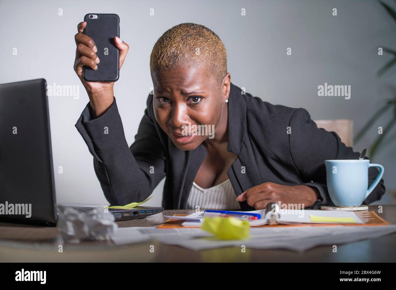 stressed and frustrated afro American black woman working overwhelmed ...