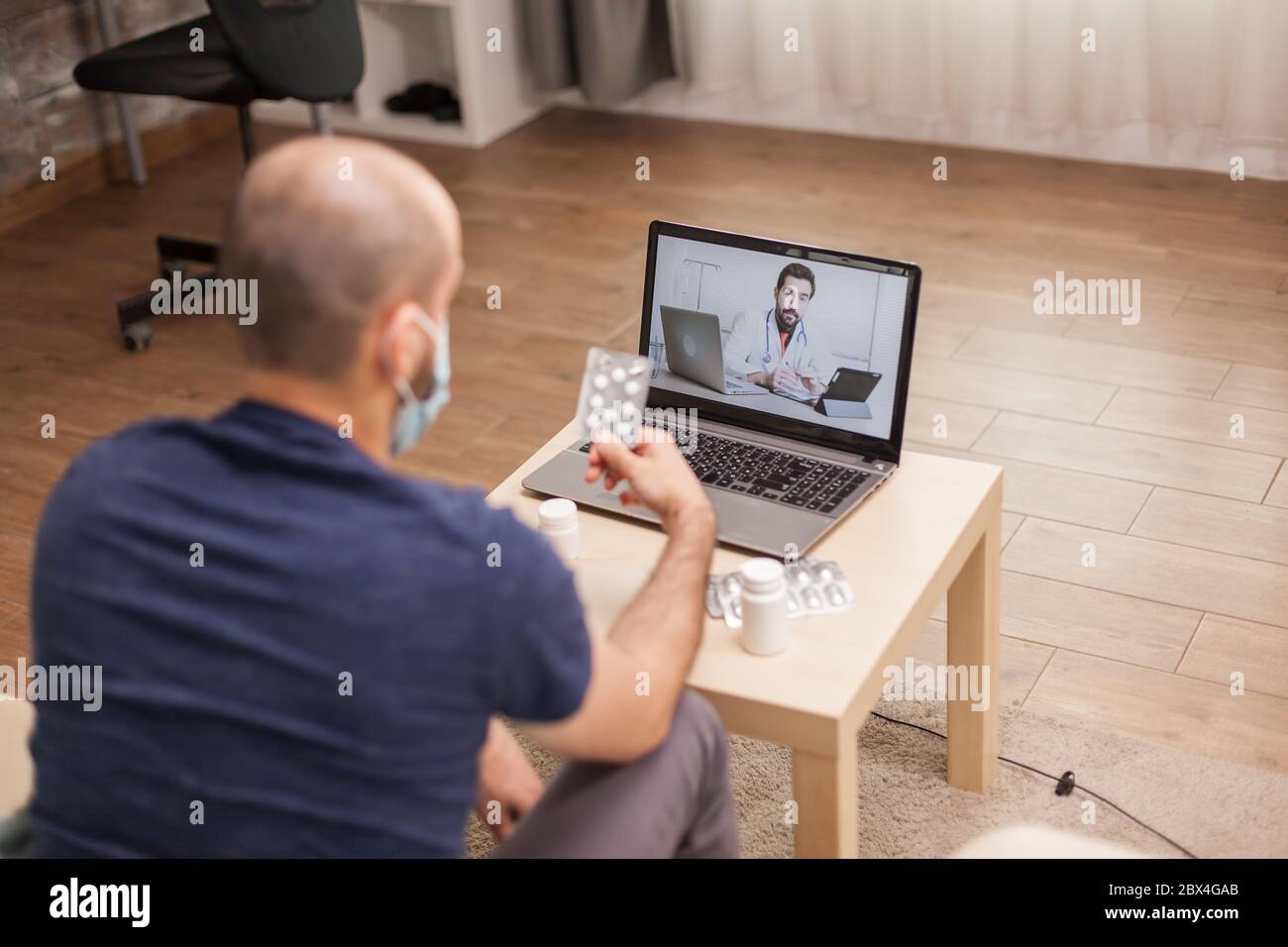 Sick guy in video call with doctor talking about his ill medicine ...