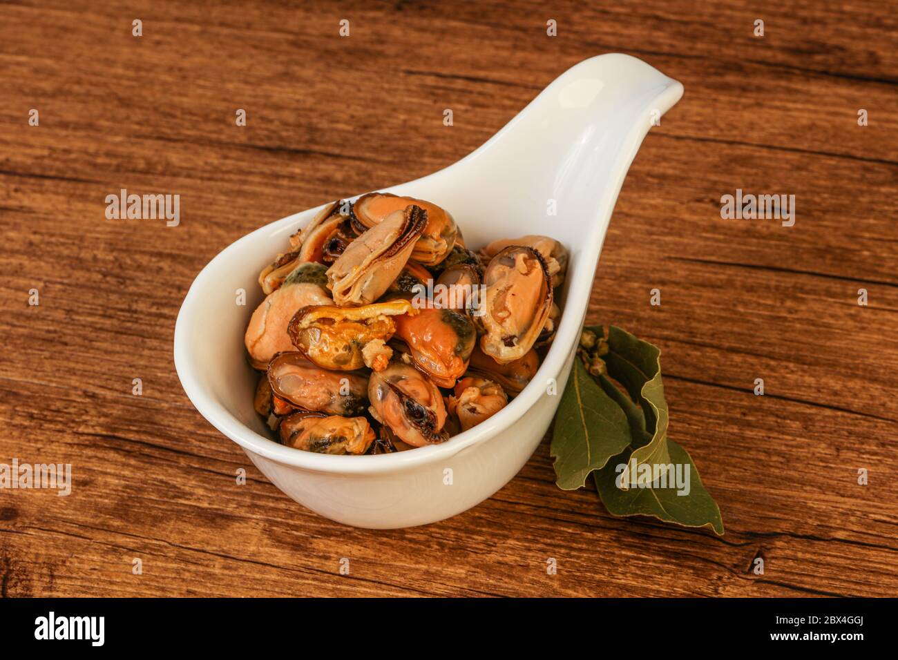 Pickled mussels with spices in the bowl Stock Photo - Alamy