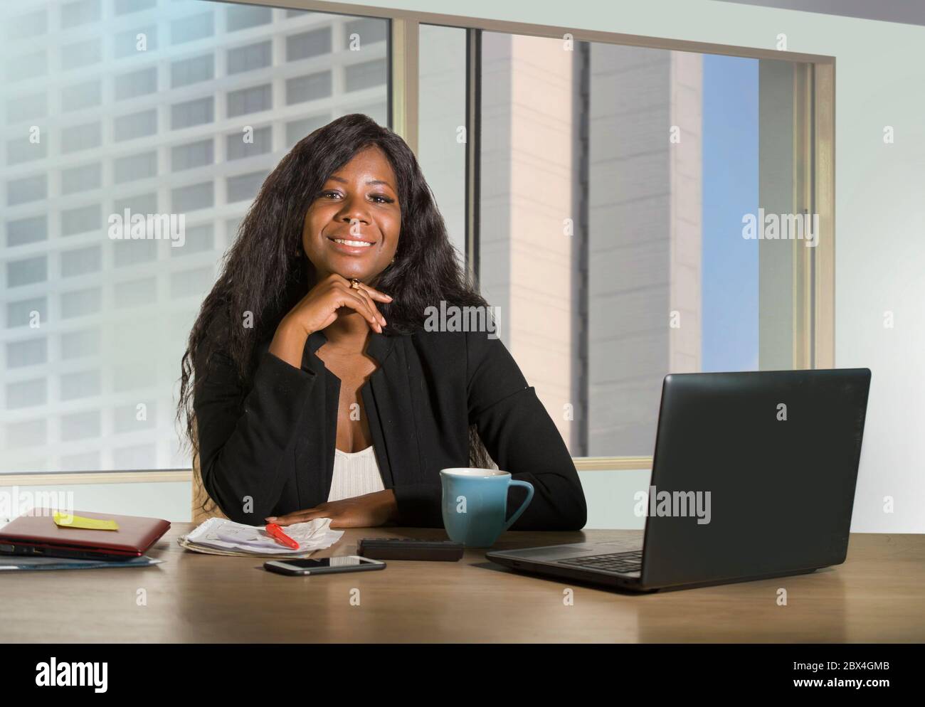 office corporate portrait of young happy and attractive black African ...