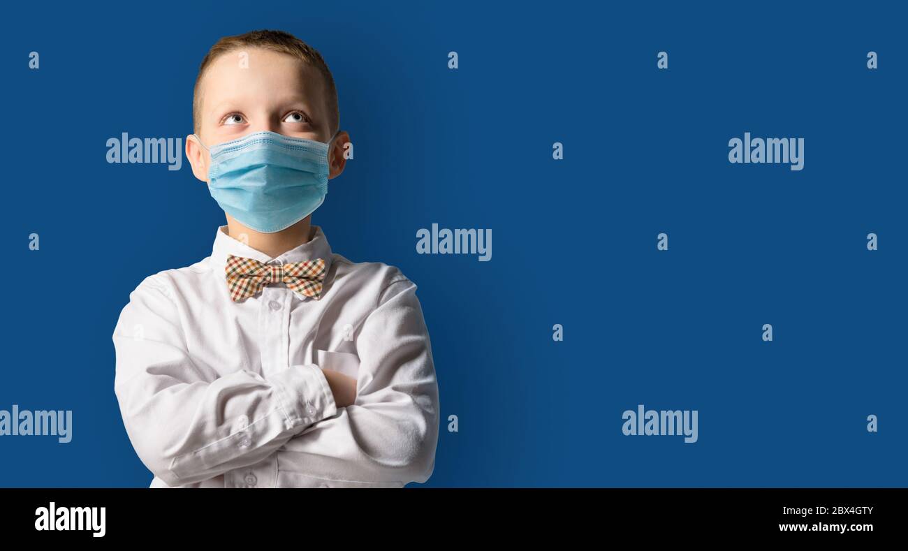 Happy school boy in mask Stock Photo - Alamy