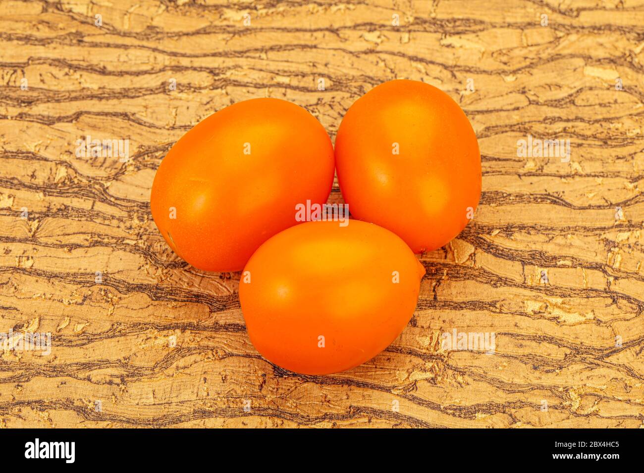 Tasty vegetables - Yellow tomato heap over background Stock Photo - Alamy