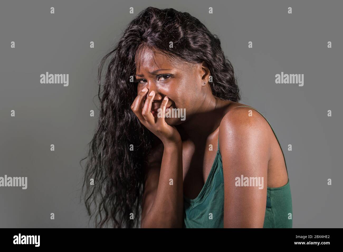 young attractive sad and depressed black African American woman feeling ...