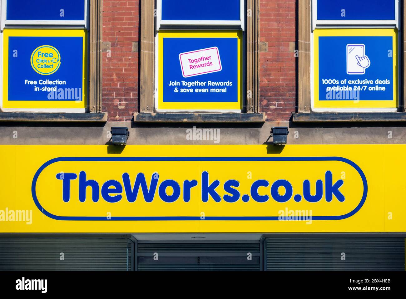 A sign above the entrance to theworks.co.uk in Liverpool Stock Photo ...
