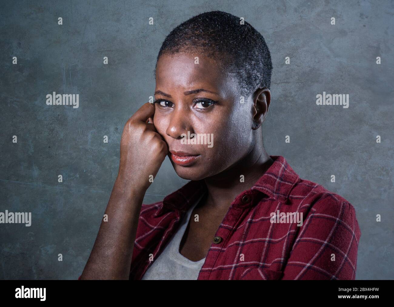 lifestyle isolated portrait of young attractive and sad black african ...