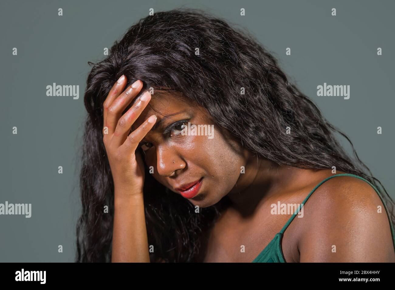 young attractive sad and depressed black African American woman feeling ...