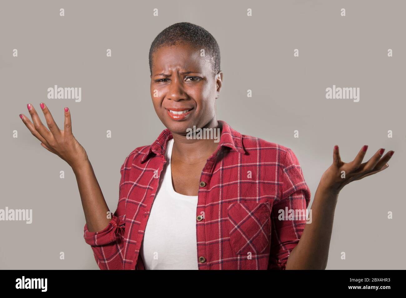 lifestyle isolated portrait of young pretty and unhappy black afro ...
