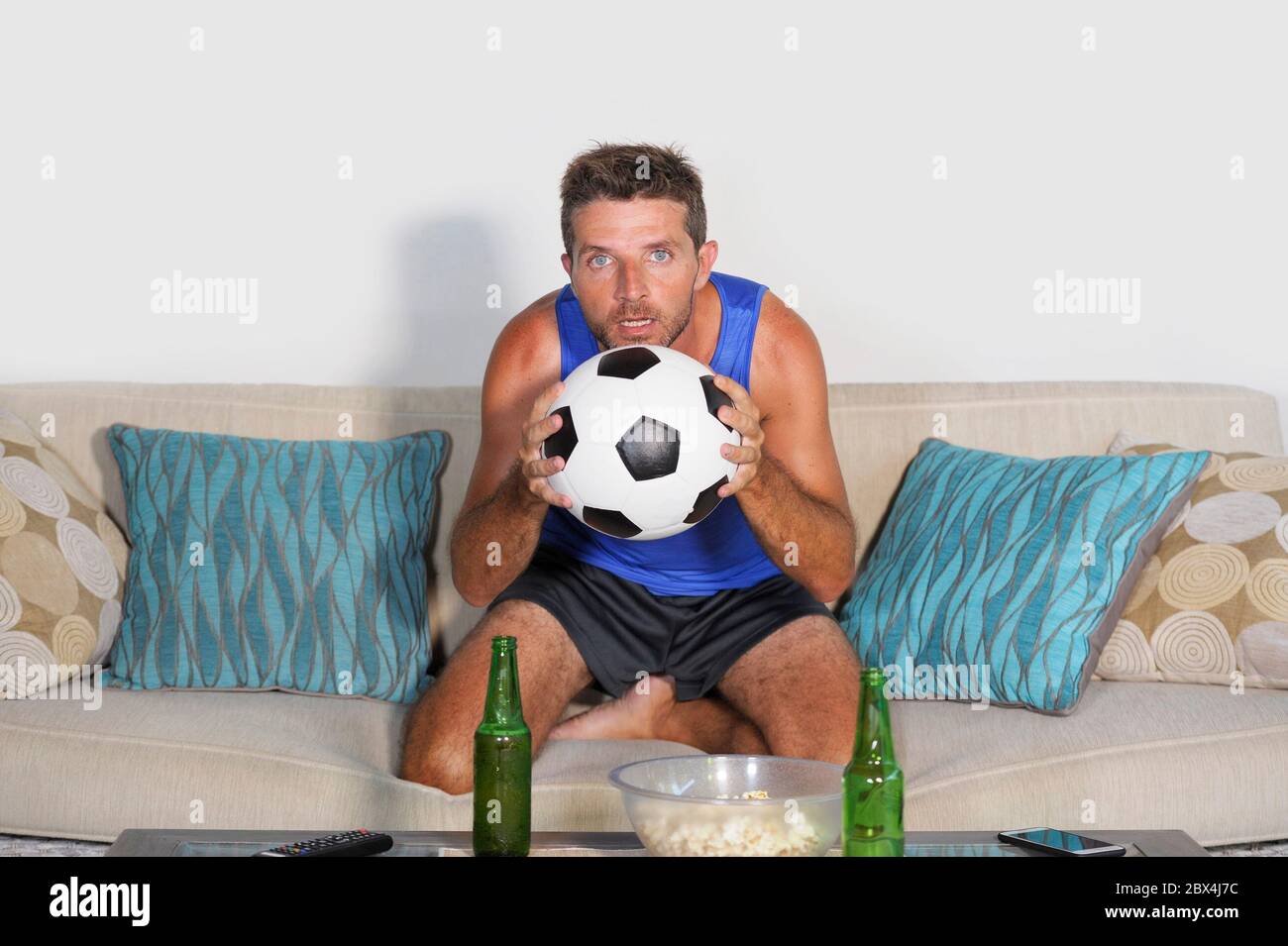 passionate football fan supporter man watching match on television ...