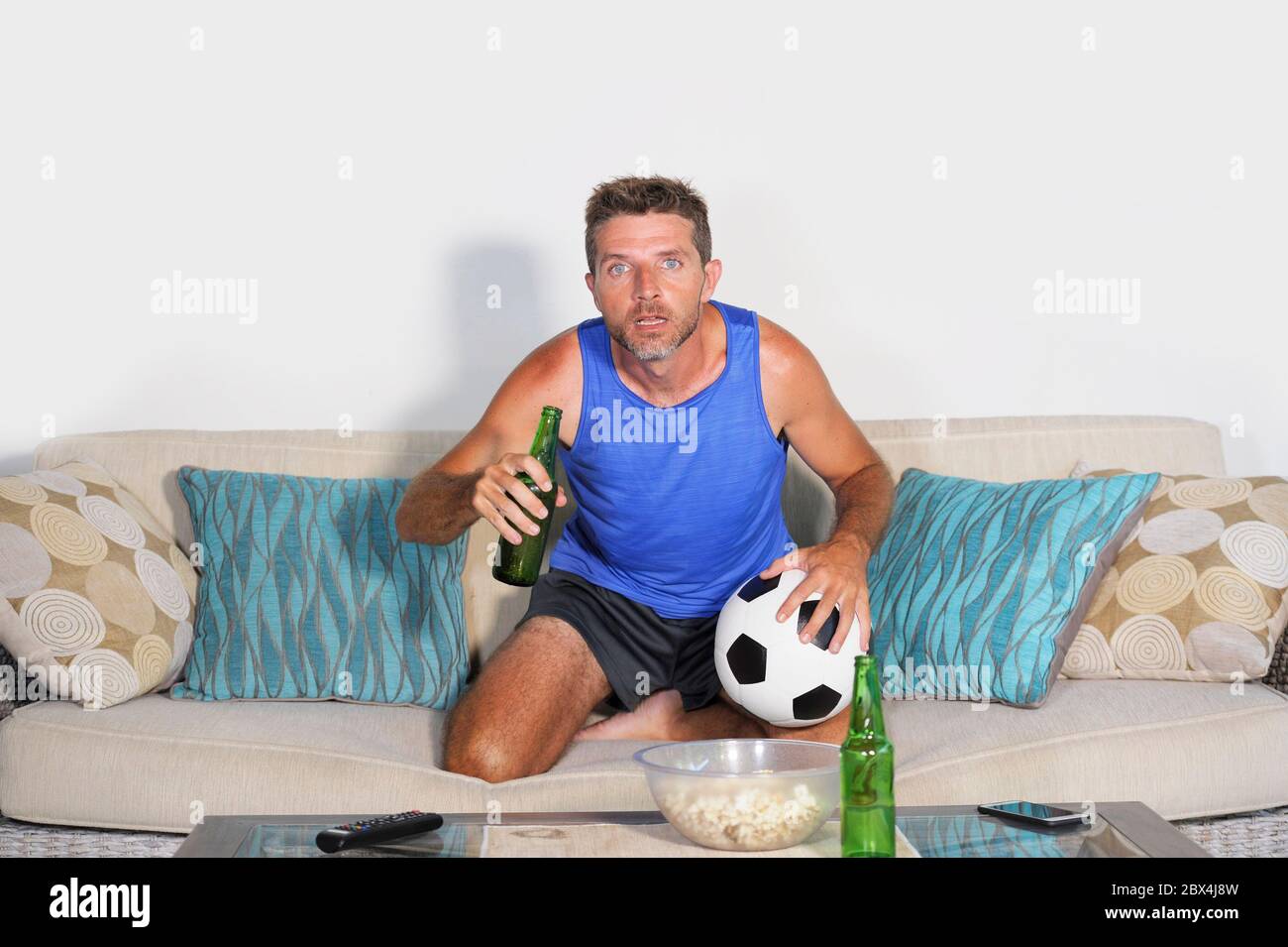 passionate football fan supporter man watching match on television ...