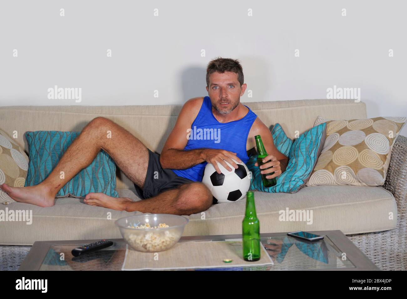 passionate football fan supporter man watching match on television ...