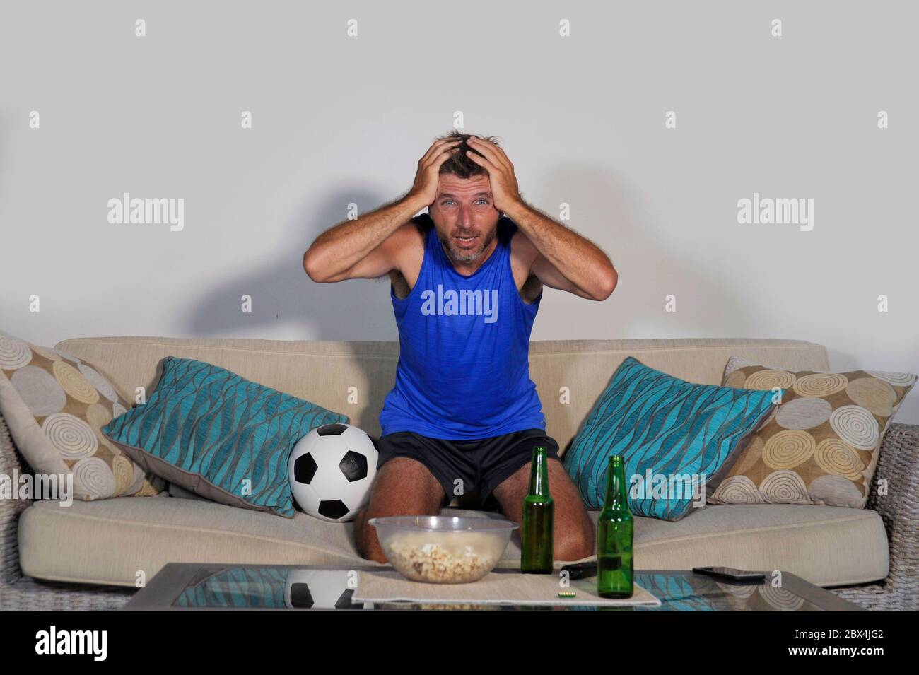 passionate football fan supporter man watching match on television ...