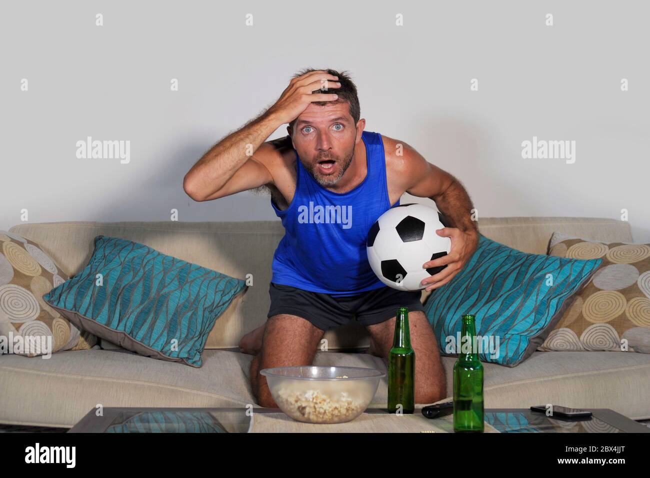 passionate football fan supporter man watching match on television ...
