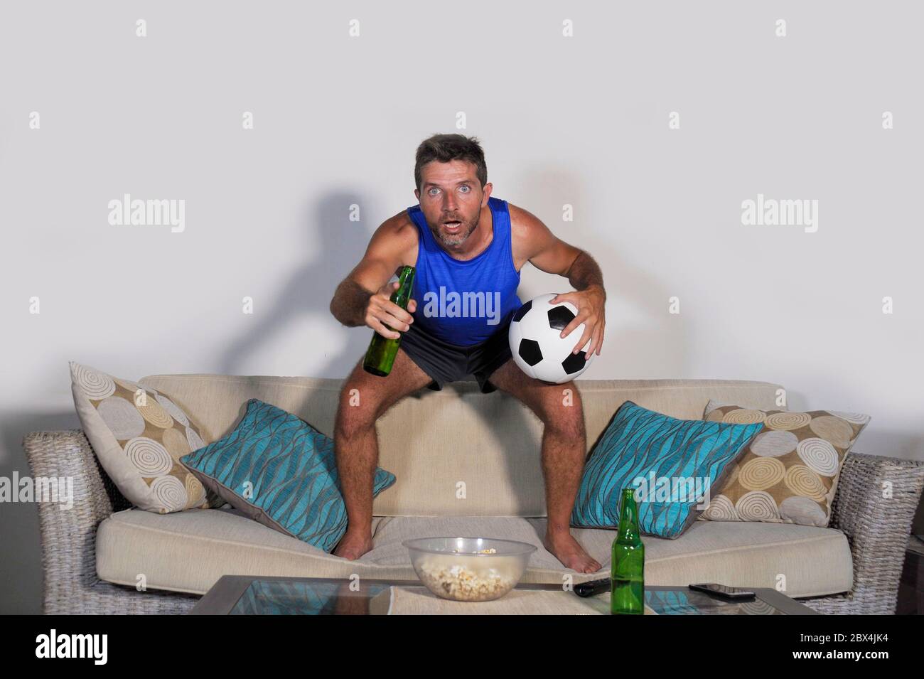 passionate football fan supporter man watching match on television ...