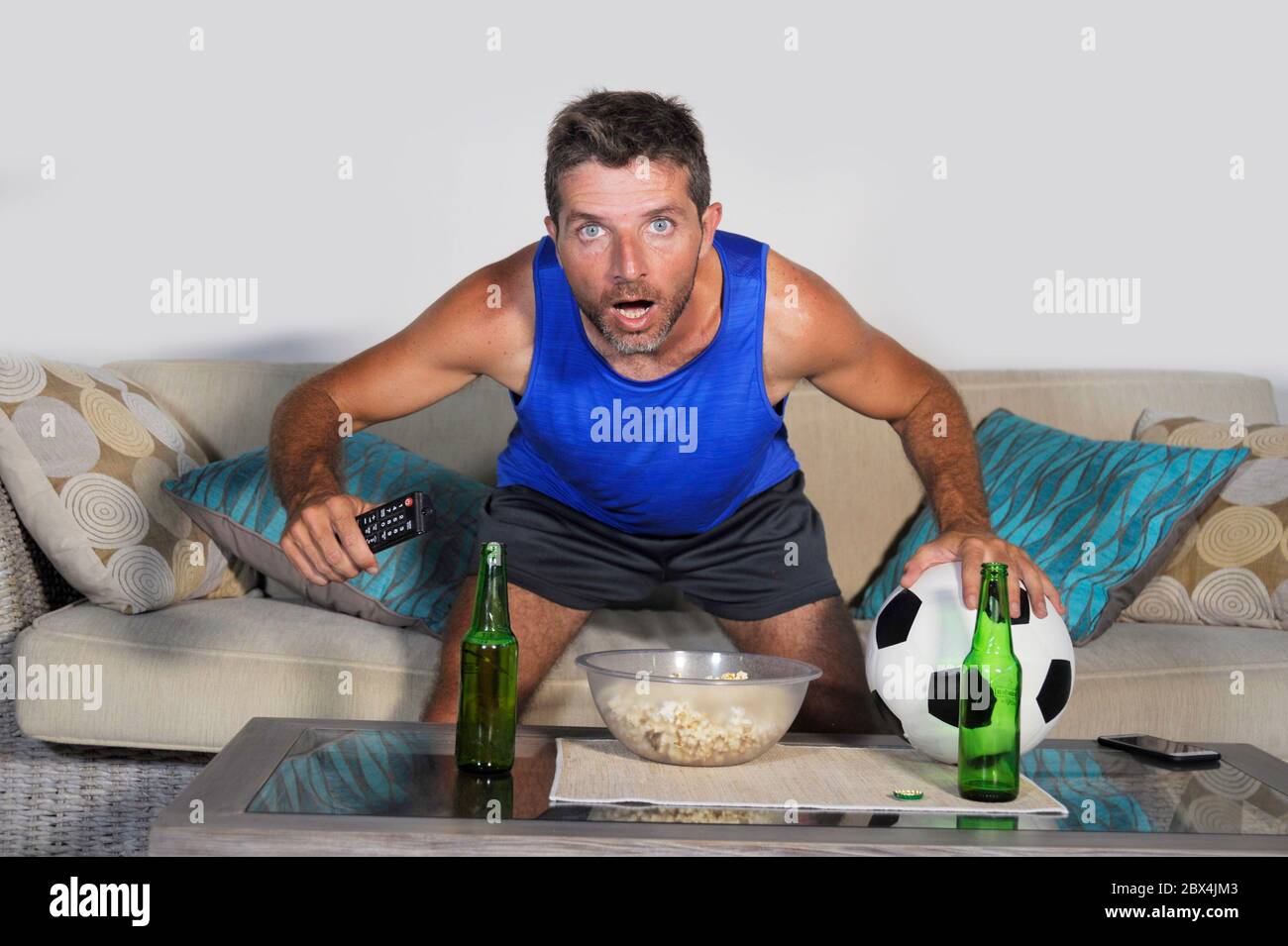 passionate football fan supporter man watching match on television ...